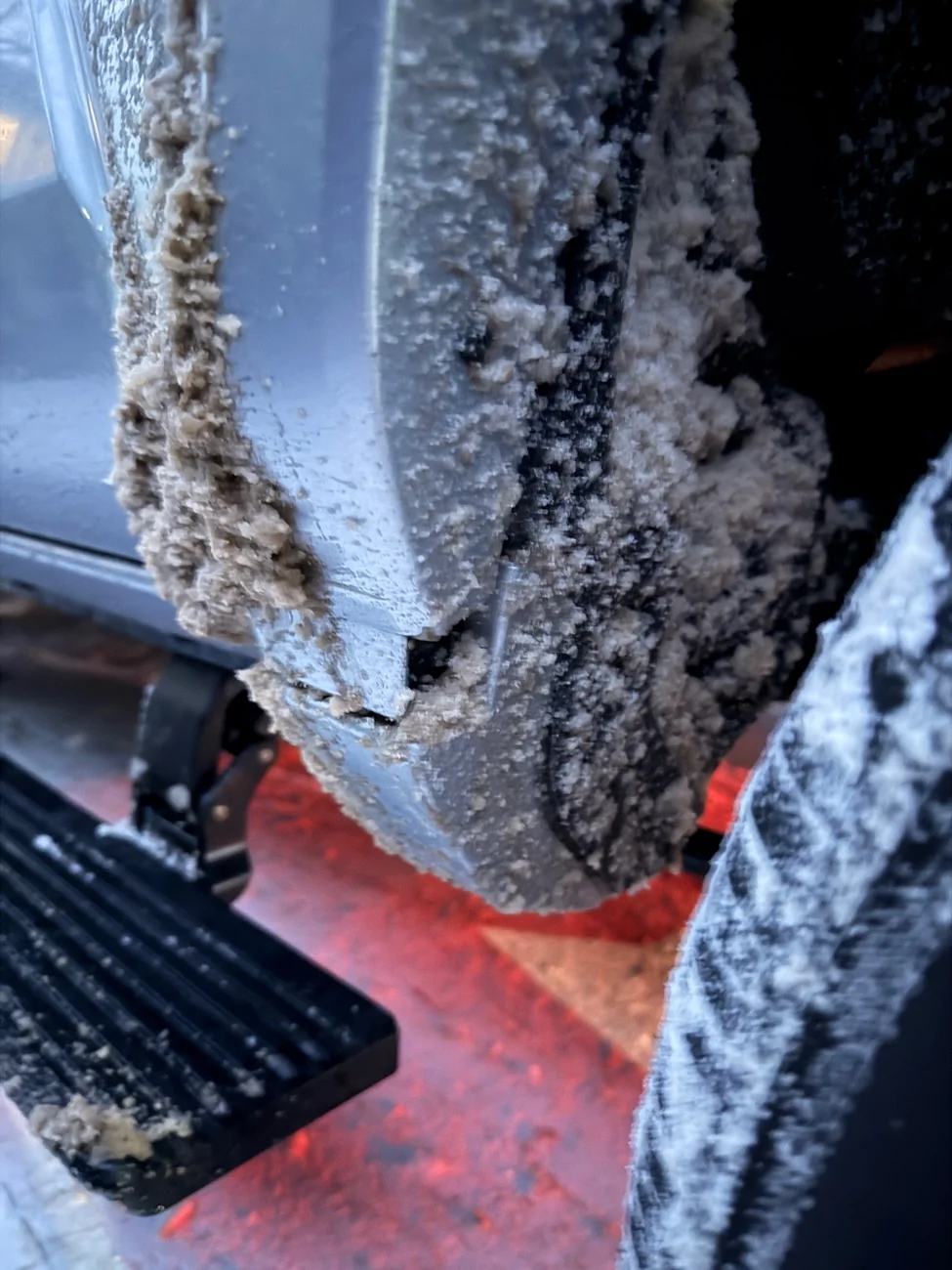 Gap below rear door letting snow/mud inside — normal design or missing ...